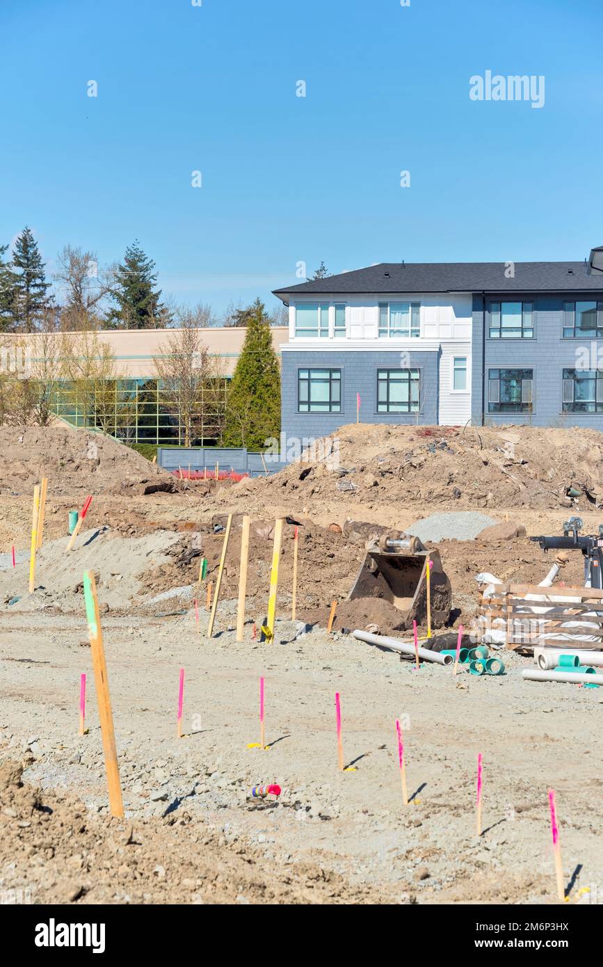 Construction zone with new building development on blue sky background ...