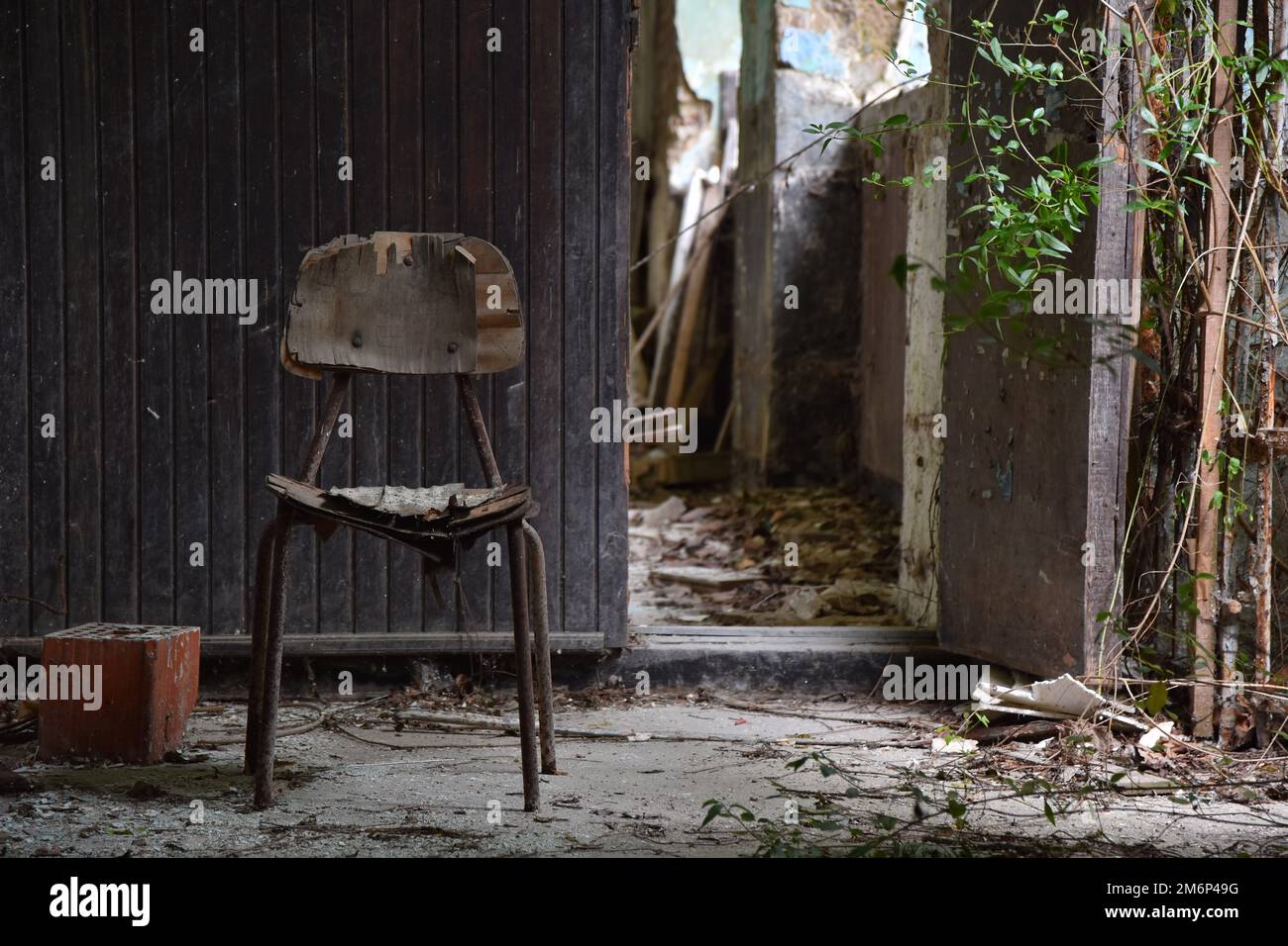 A rotten chair in an abandoned building Stock Photo - Alamy