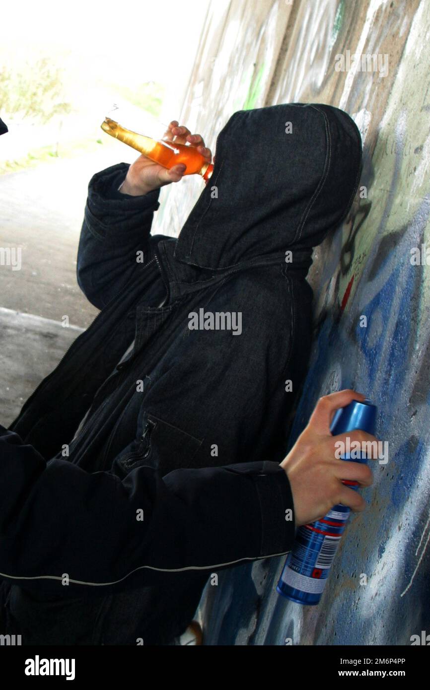 Irvine, Ayrshire, Scotland, UK. Hooded Youths loitering drinking and ...
