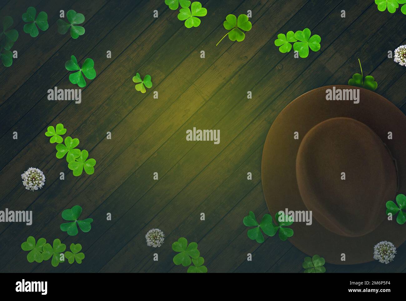 Spring Saint Patrick's Day, dark wood background with green clovers ...