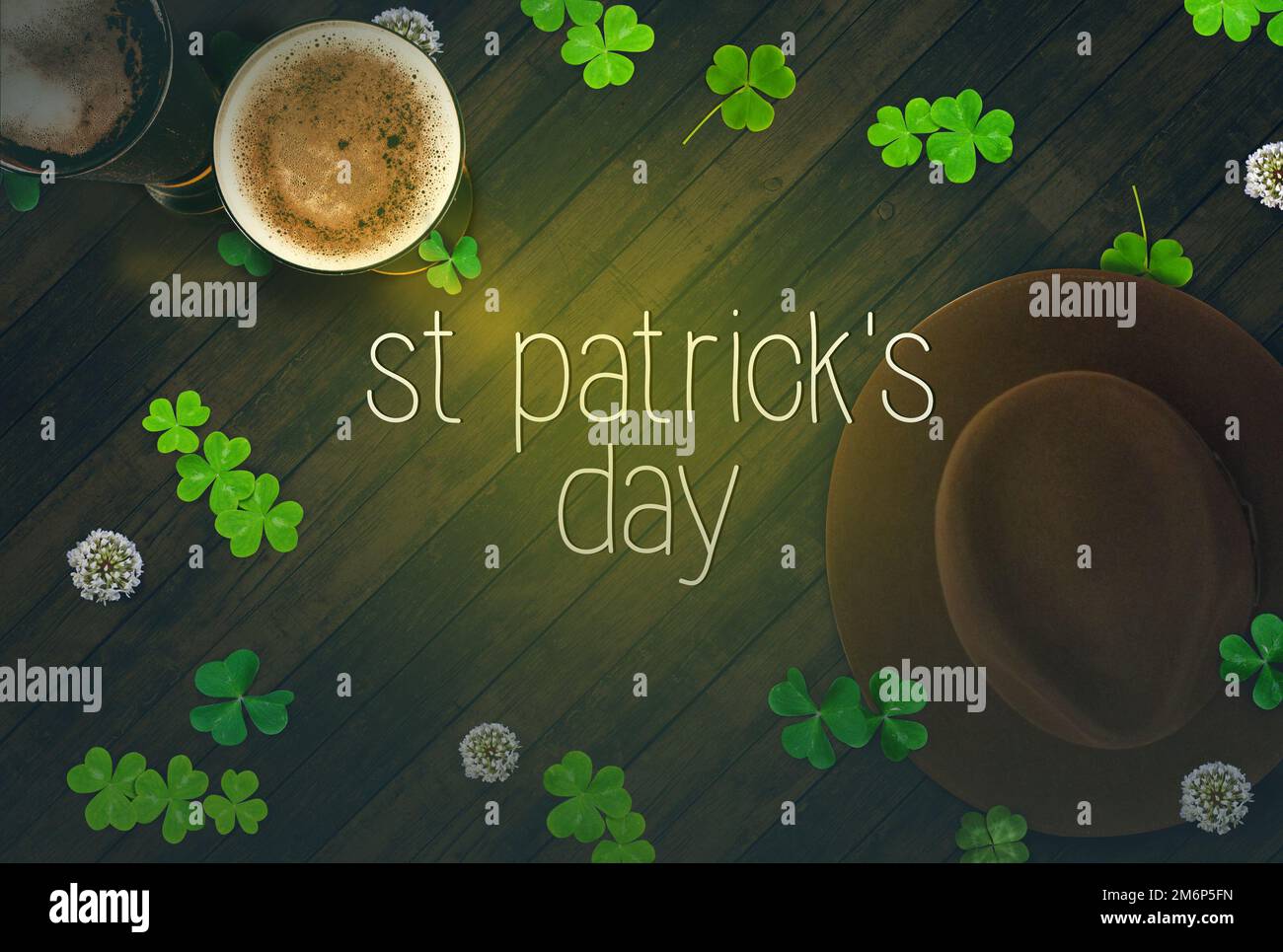 Spring Saint Patrick's Day, dark wood background with green clovers ...