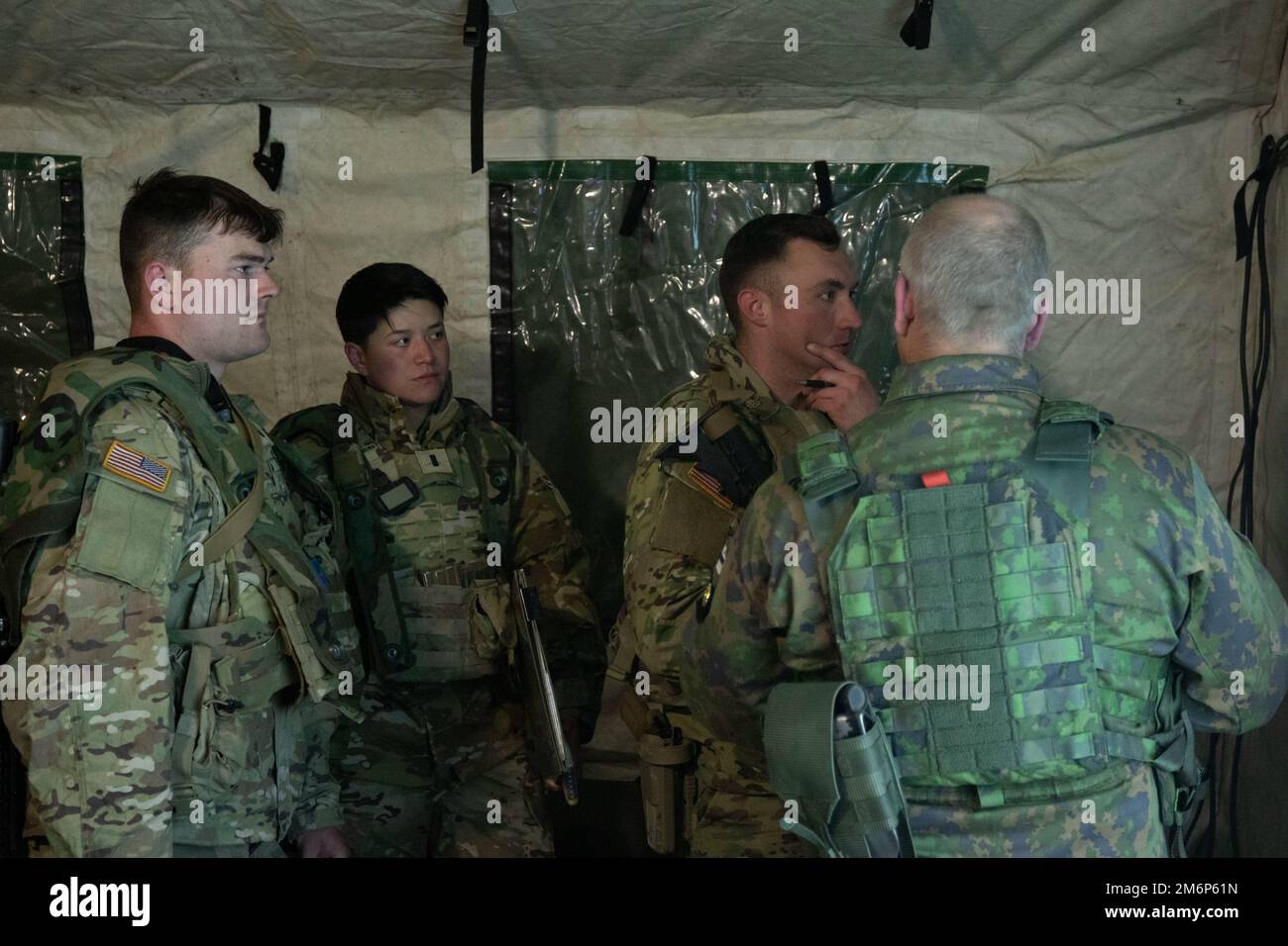 U.S. Army Cpt. Denis Majewski, center right, 1st Lt. Nicky Manzitas ...