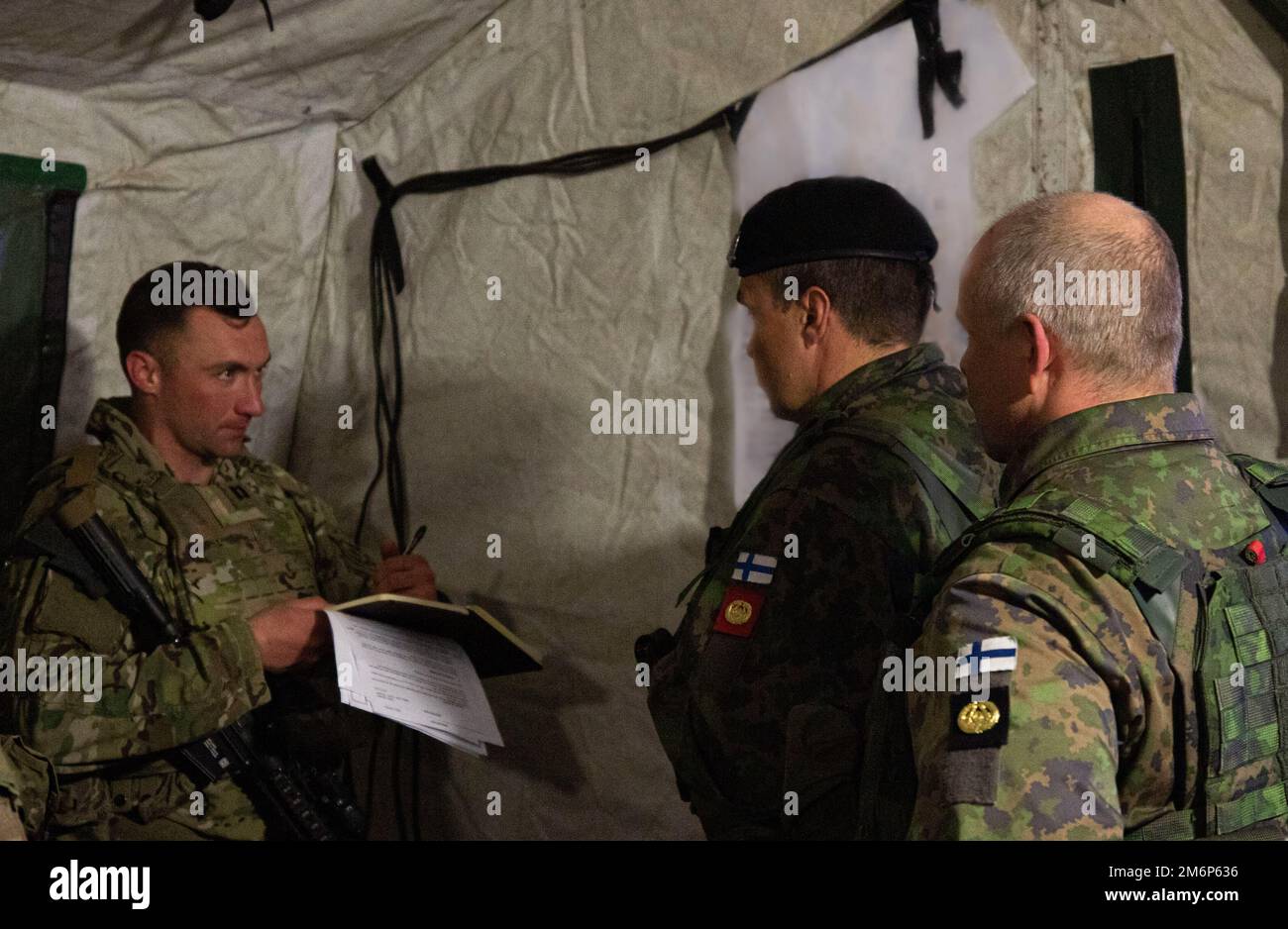 U.S. Army Capt. Denis Majewski conducts a back brief to Finnish Lt. Col ...