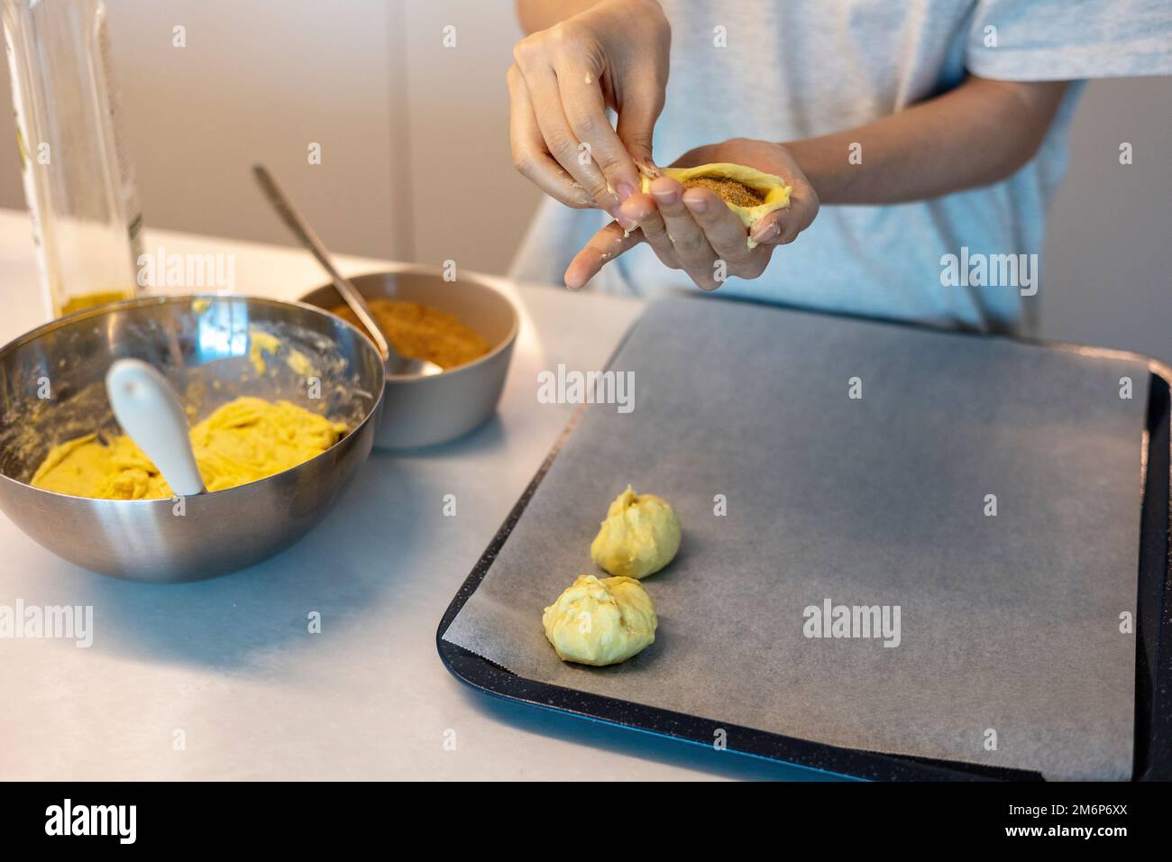Making cookie bread with sugar before baking, shape dough into a ball ...