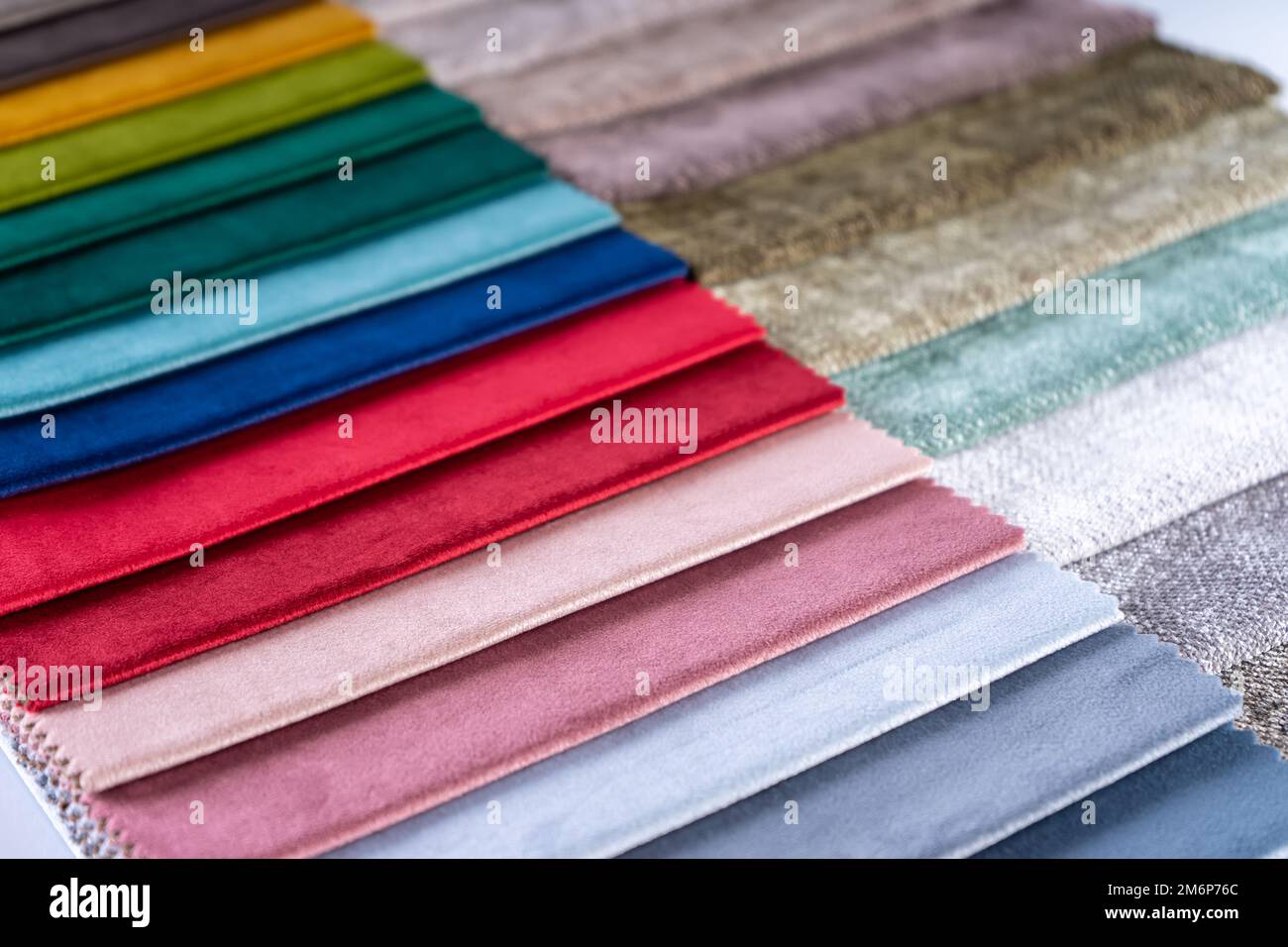 Bright collection of colorful textile samples. Fabric swatches, set in ...