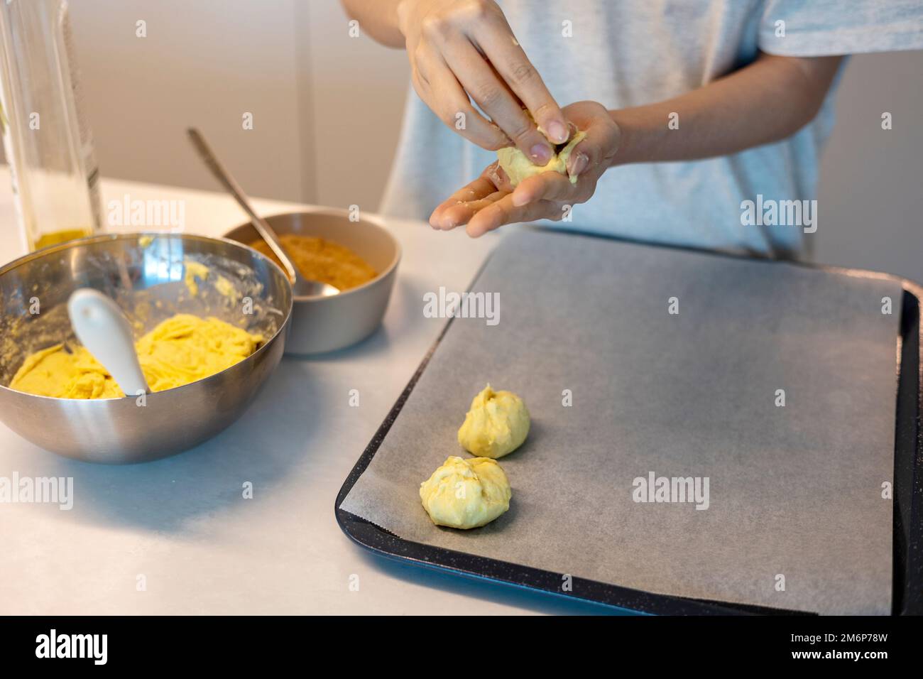 Making cookie bread with sugar before baking, shape dough into a ball ...