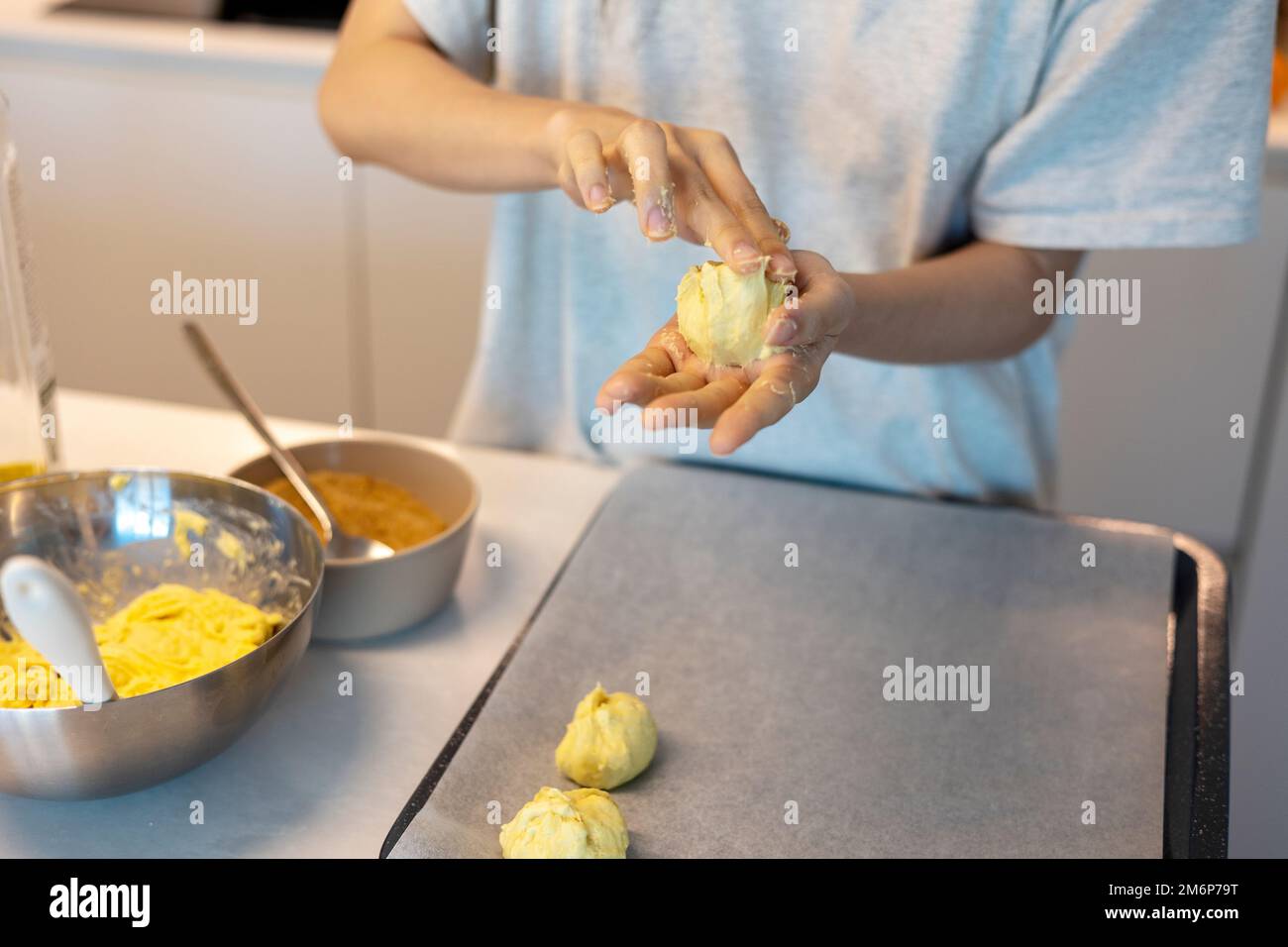 Making cookie bread with sugar before baking, shape dough into a ball ...