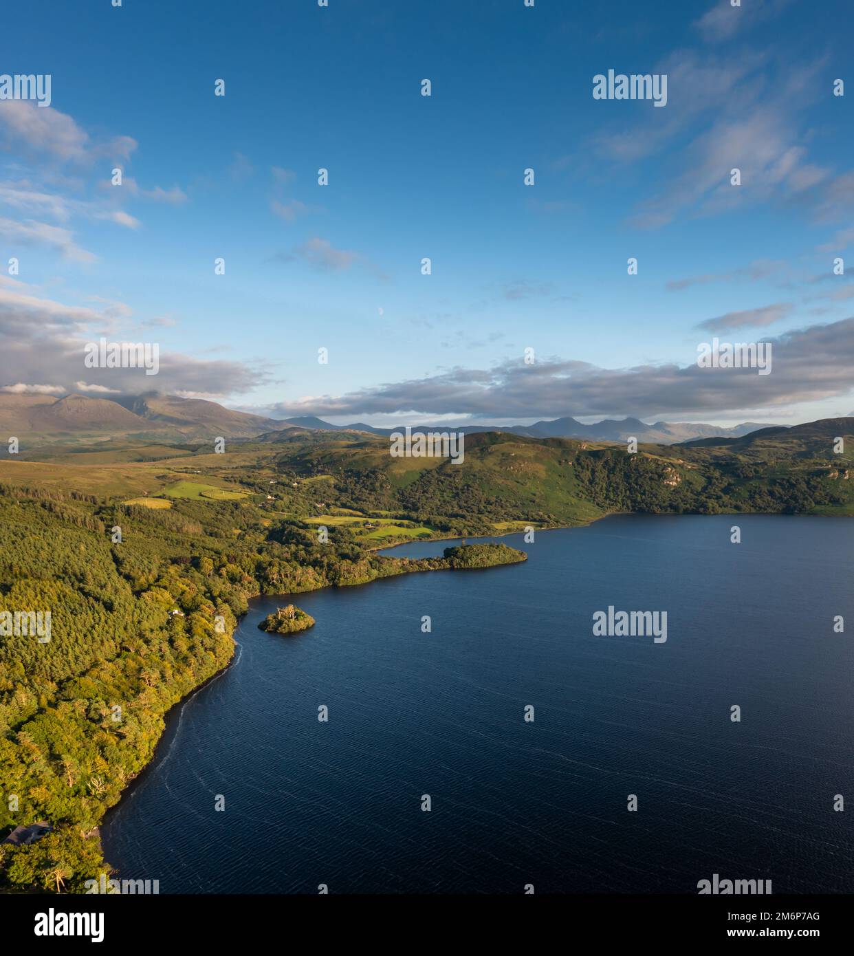 View of Lough Caragh lake in the Glencar Valley of Kerry County in warm ...