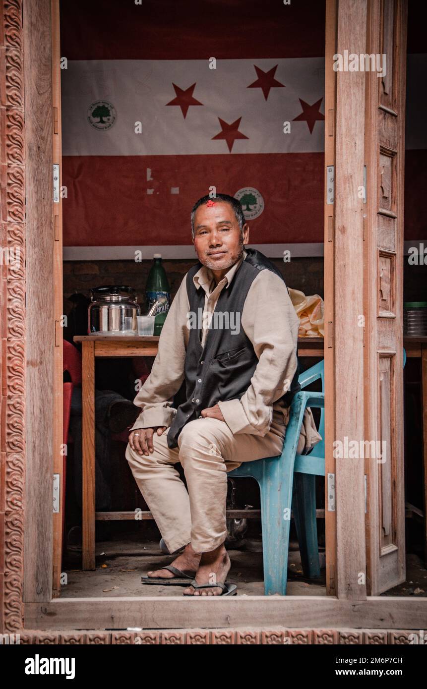 Faces of Nepal: Mature Man Sitting in Political Office Stock Photo - Alamy