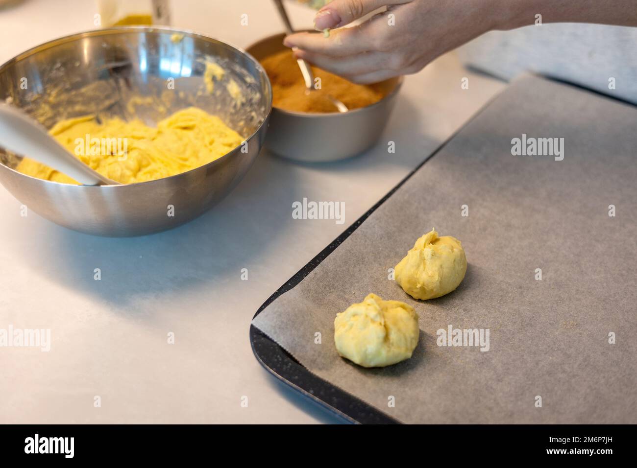 Making cookie bread with sugar before baking, shape dough into a ball ...