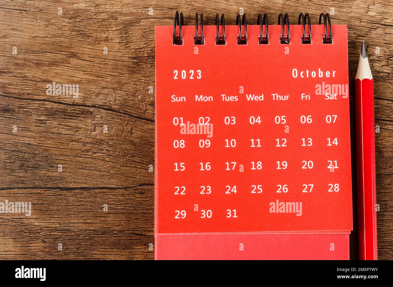 Red October 2023 Monthly desk calendar for 2023 year with pencil on ...