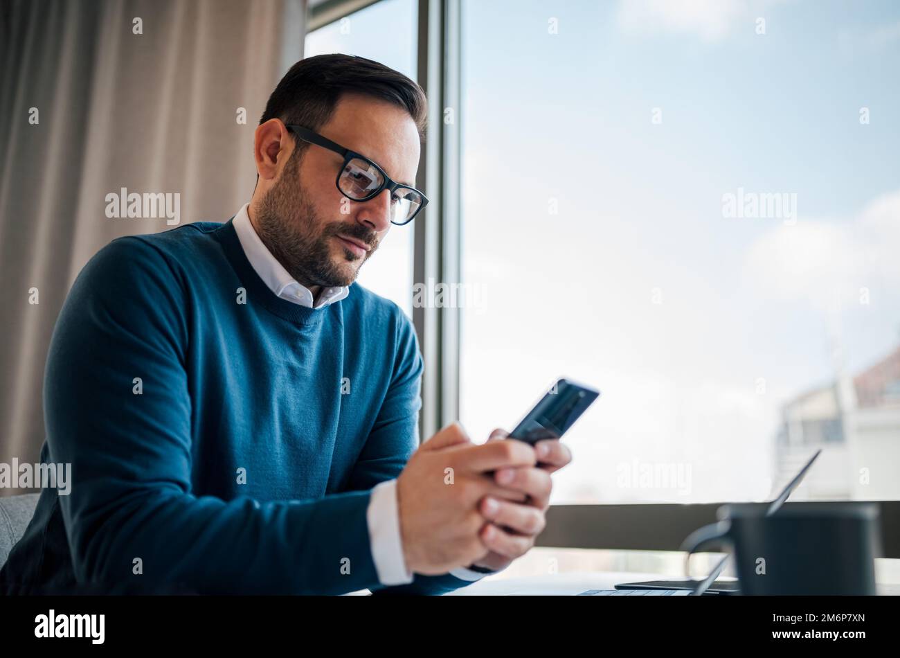 Professional adult businessman, writing a message to his client, from ...