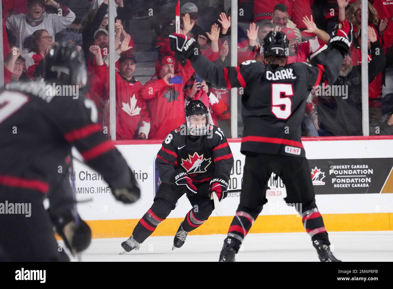 Canada's Connor Bedard, centre, reacts after scoring the game-winning ...