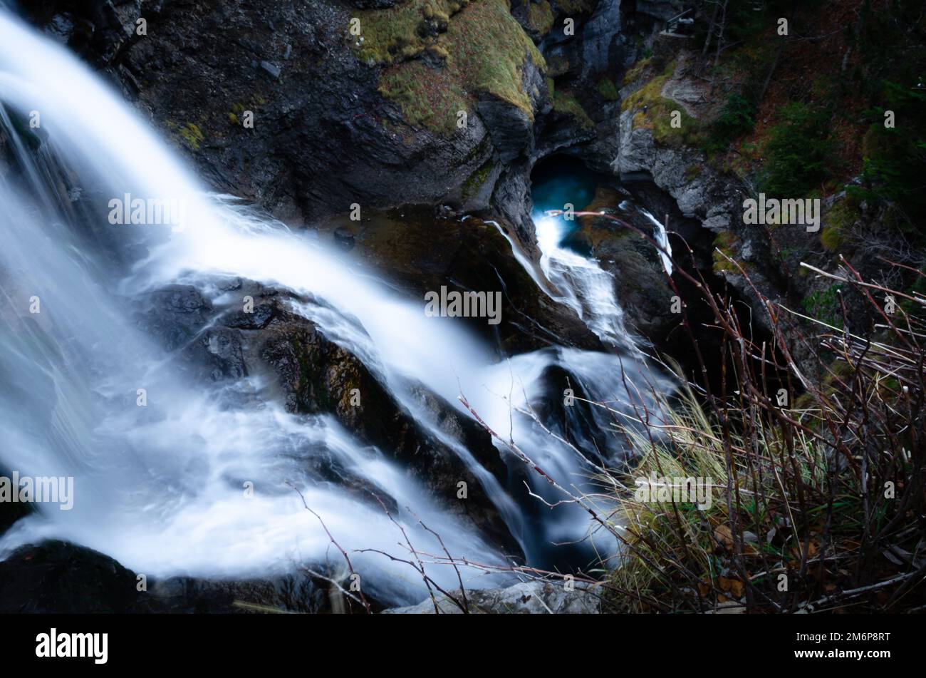 A silk effect water flowing down a rocky cliff Stock Photo - Alamy