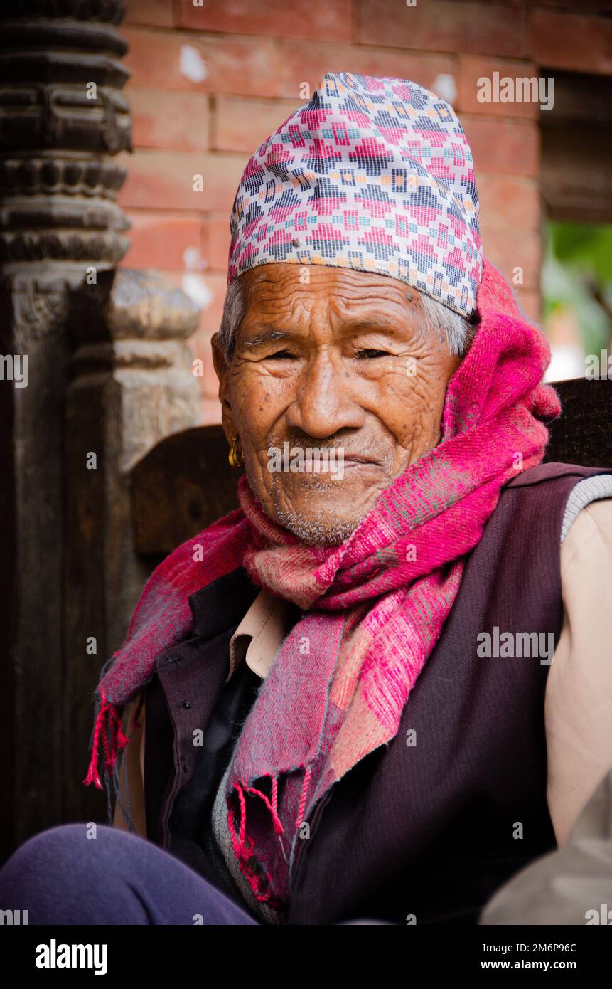 Faces of Nepal - Mature Men wearing Nepali topi Stock Photo - Alamy
