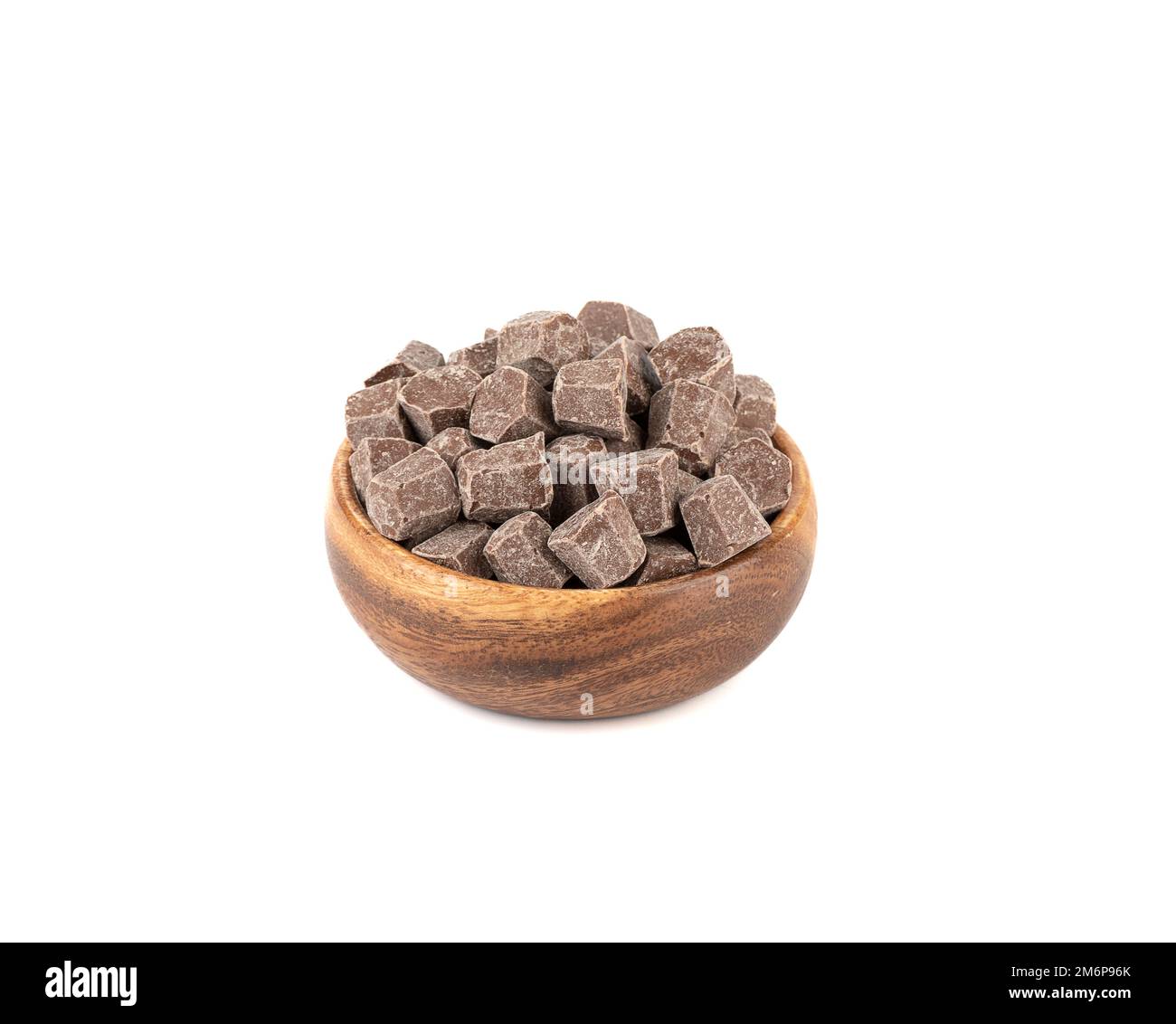 Chocolates in the form of diamonds in a bowl over a white background ...