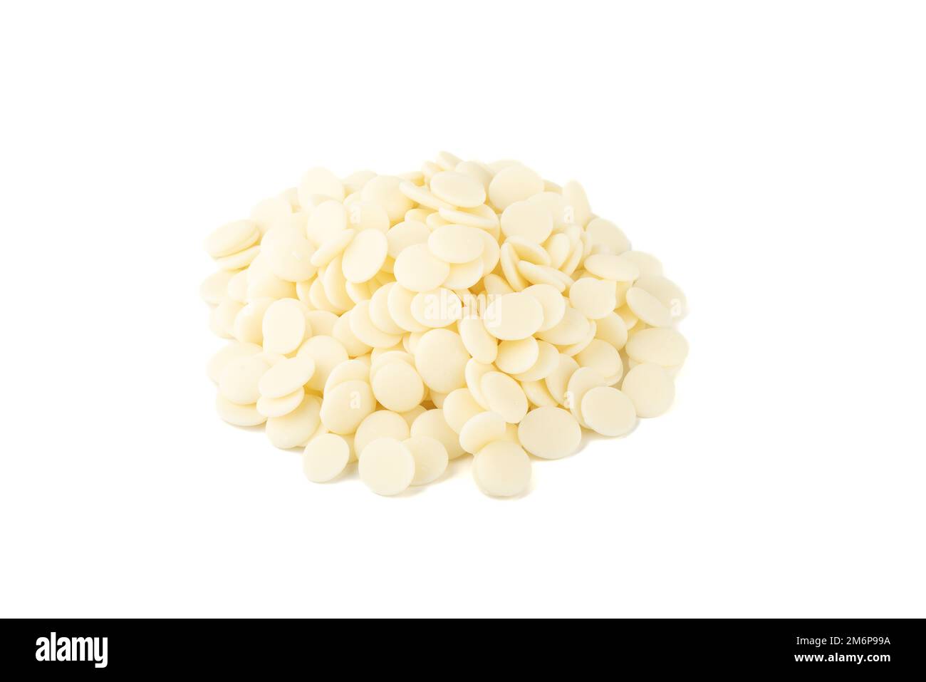 Heap of icing in the form of milk chocolate drops on a white background ...