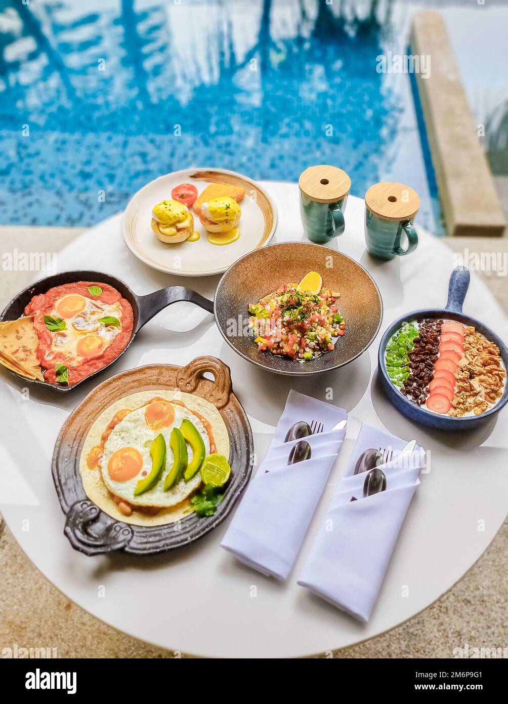 Luxury breakfast by a swimming pool during vacation. Breakfast with ...