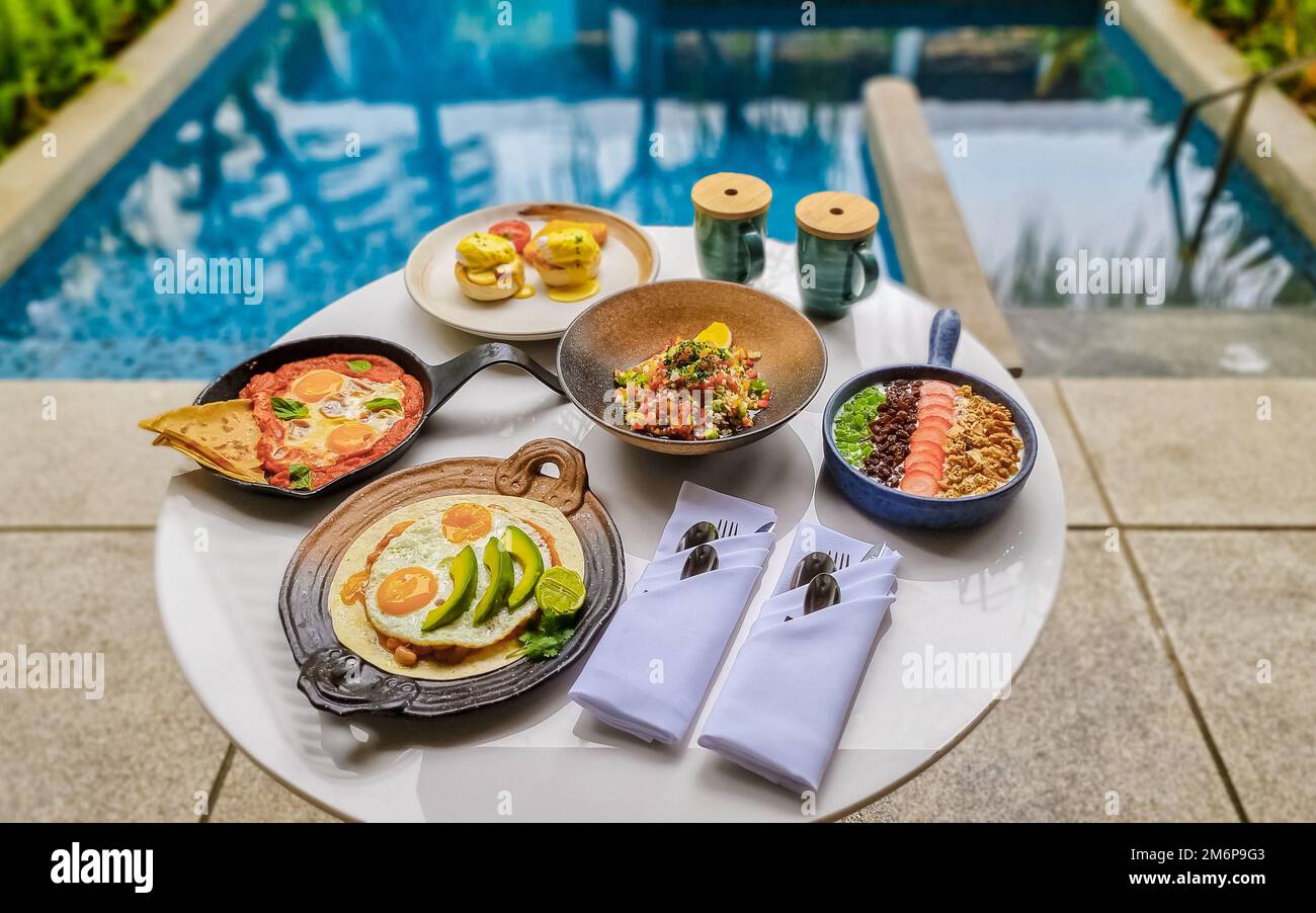 Luxury breakfast by a swimming pool during vacation. Breakfast with ...
