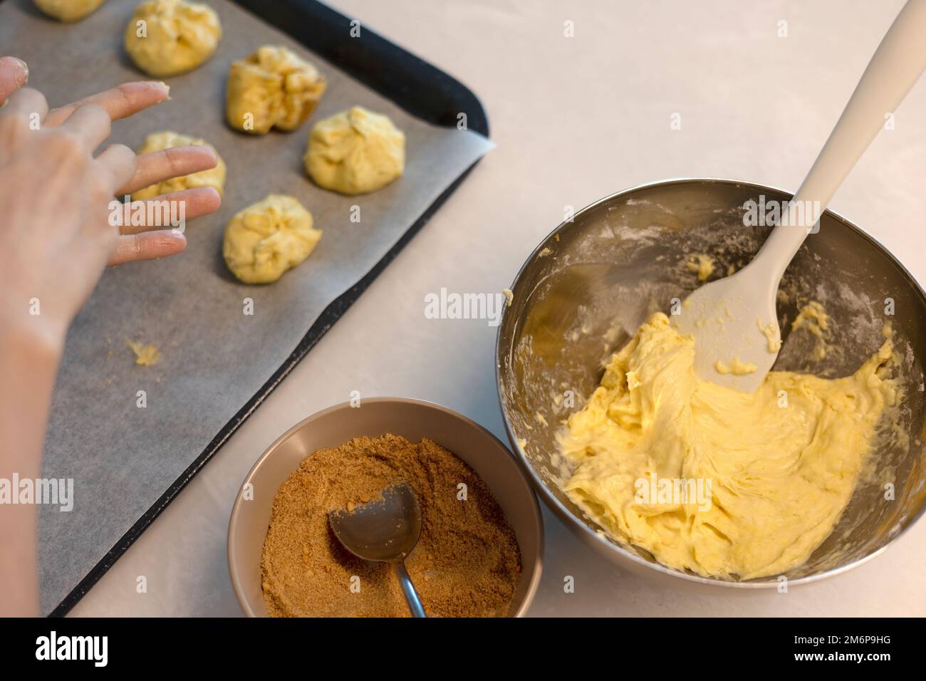 Making cookie bread with sugar before baking, shape dough into a ball ...