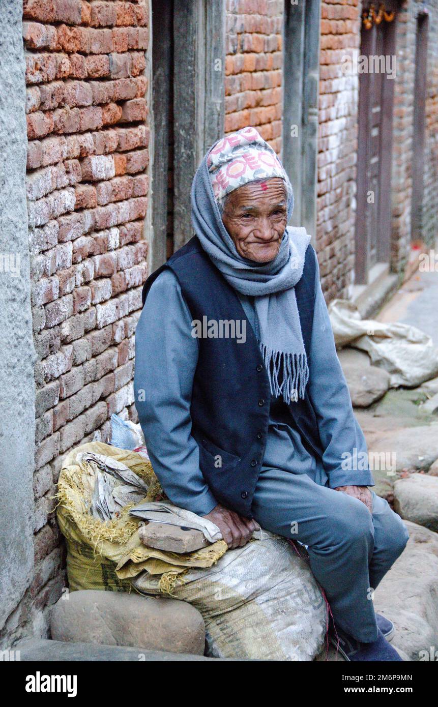 Faces of Nepal - Mature Men wearing Nepali topi Stock Photo - Alamy