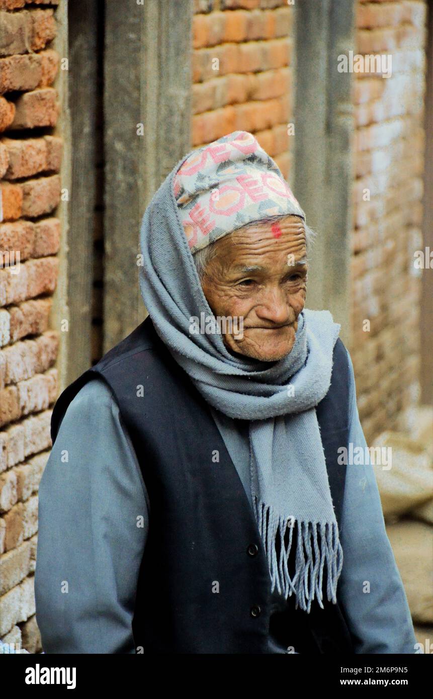 Faces of Nepal - Mature Men wearing Nepali topi Stock Photo - Alamy