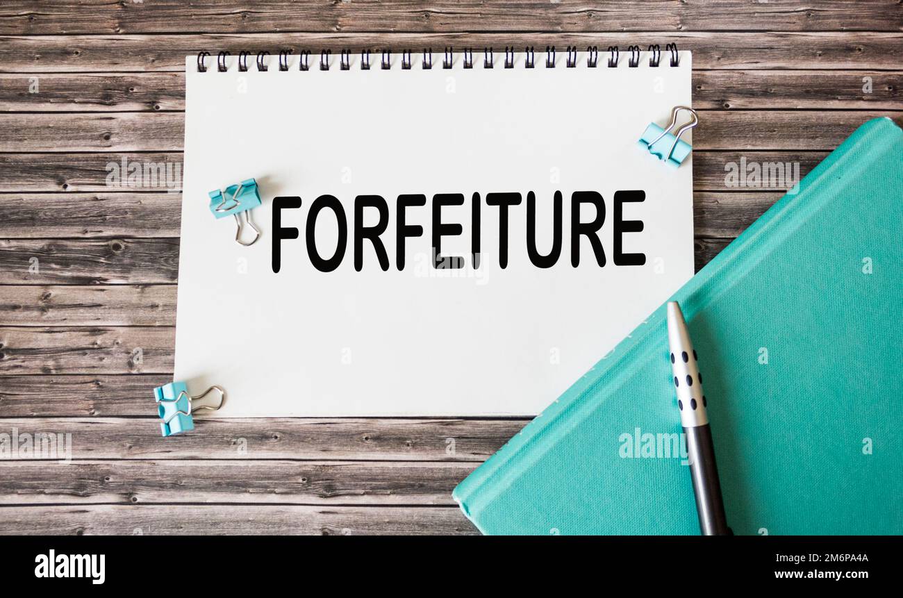 FORFEITURE - words on notepad on wooden background .Business concept ...