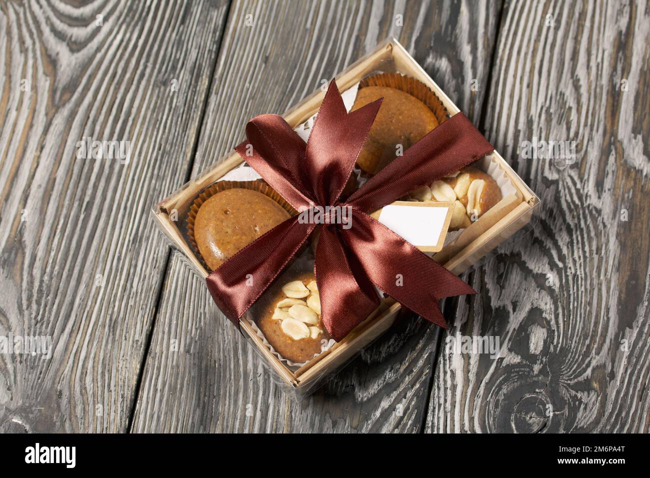 Homemade caramel. Brown caramel candies. Creamy sweets with peanuts. On ...