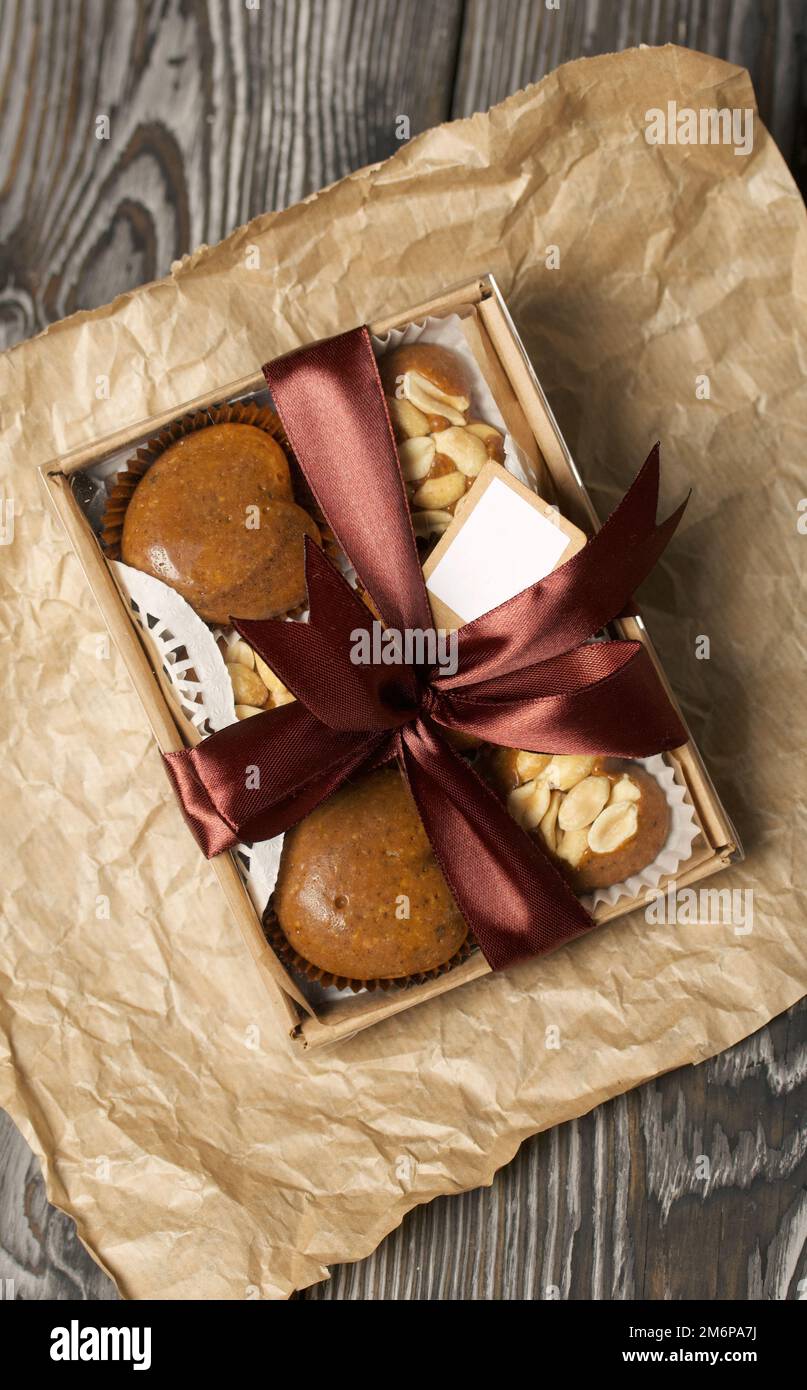 Homemade caramel. Brown caramel candies. Creamy sweets with peanuts. On ...