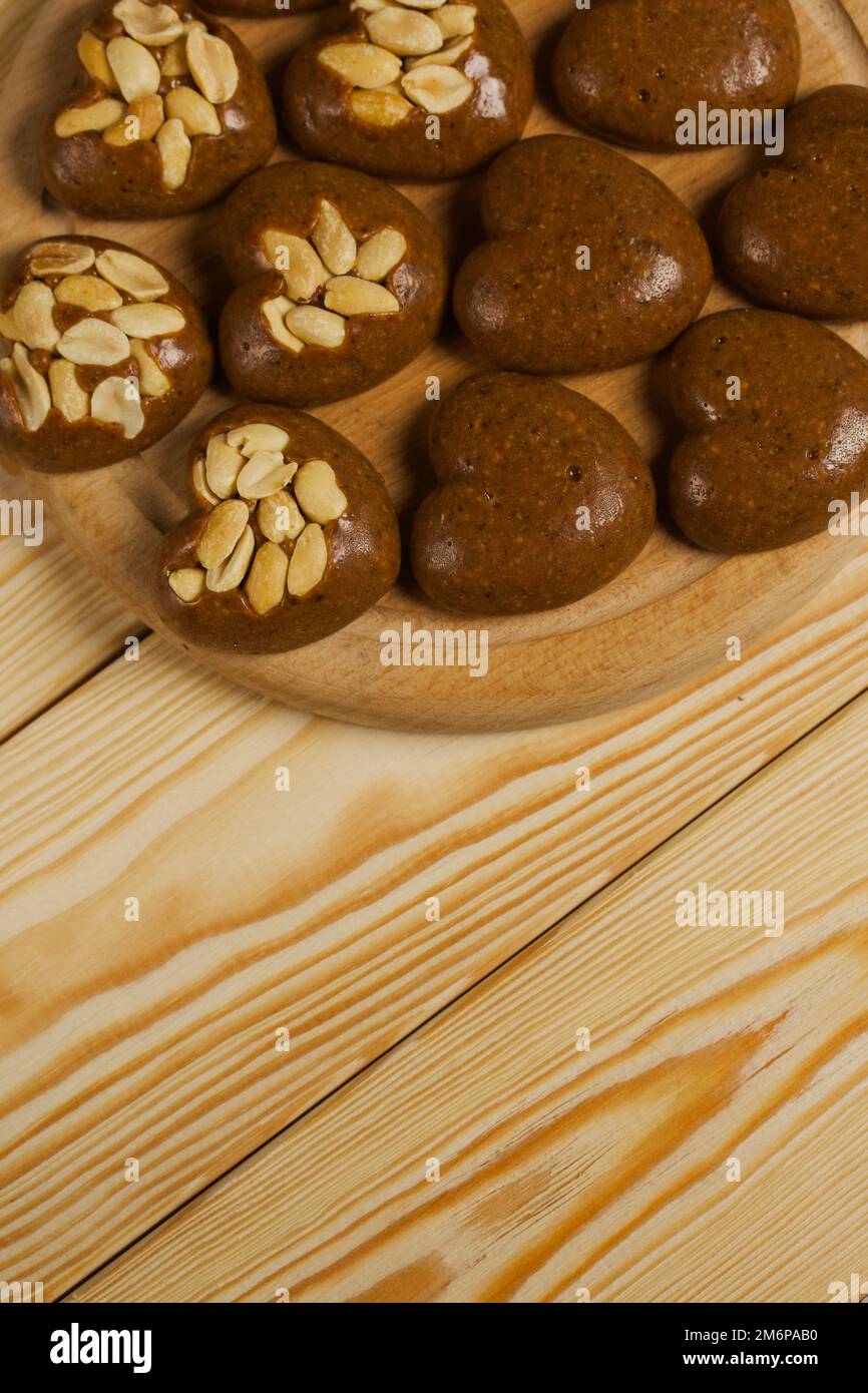 Homemade caramel. Brown caramel candies. Creamy sweets with peanuts. On ...