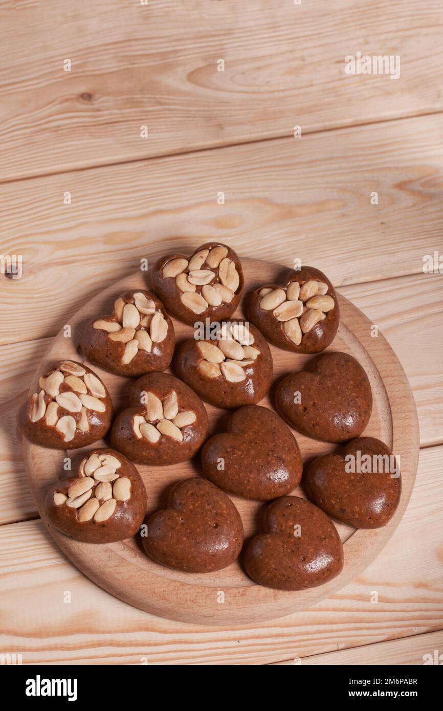 Homemade caramel. Brown caramel candies. Creamy sweets with peanuts. On ...