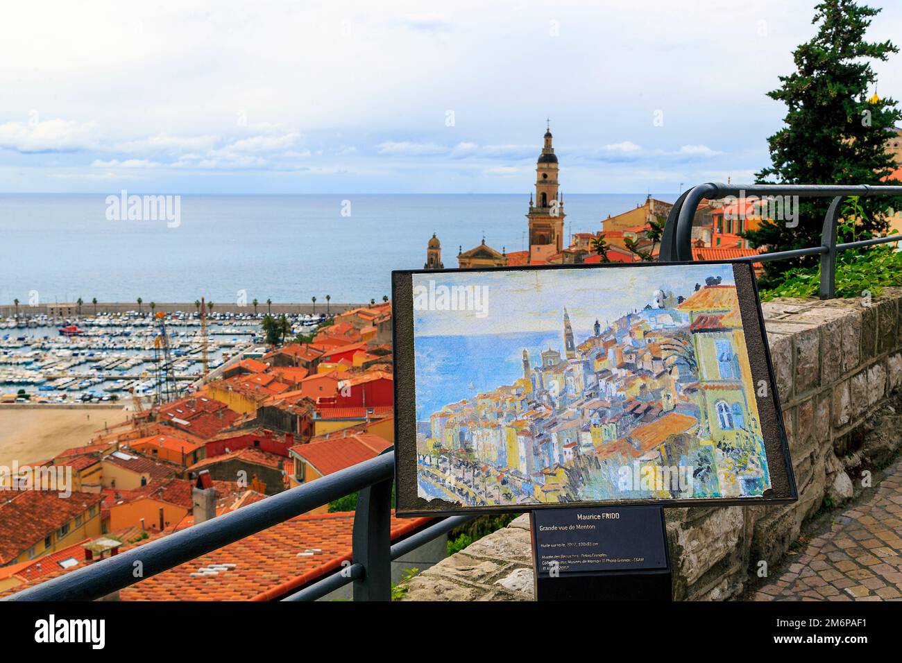 There is a reproduction of the painting with a view of the old town of ...