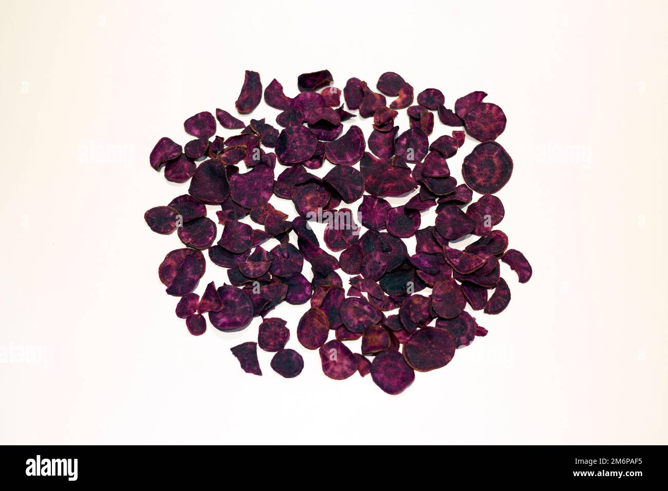 Dried purple sweet potatoes on the white background Stock Photo - Alamy