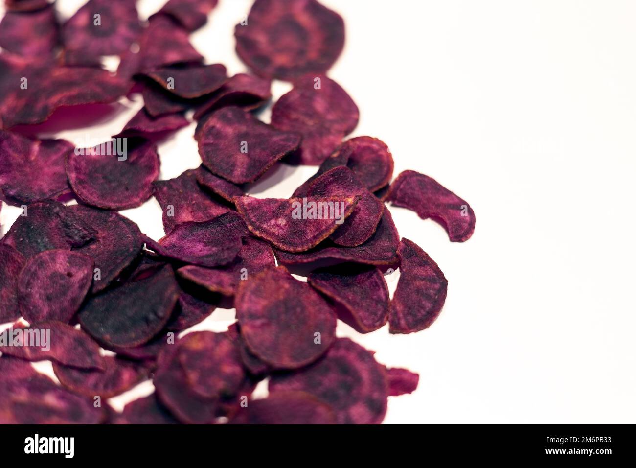 Dried purple sweet potatoes on the white background Stock Photo - Alamy