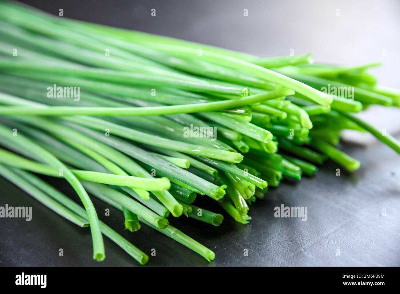 Bunch of chives closeup view Stock Photo - Alamy