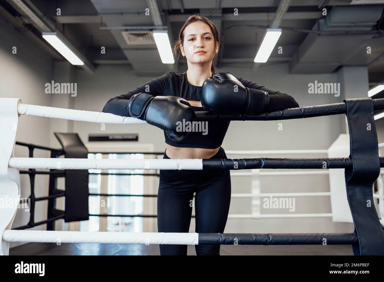 Strong latin boxing woman on the ring at fitness gym. Athletic girl ...