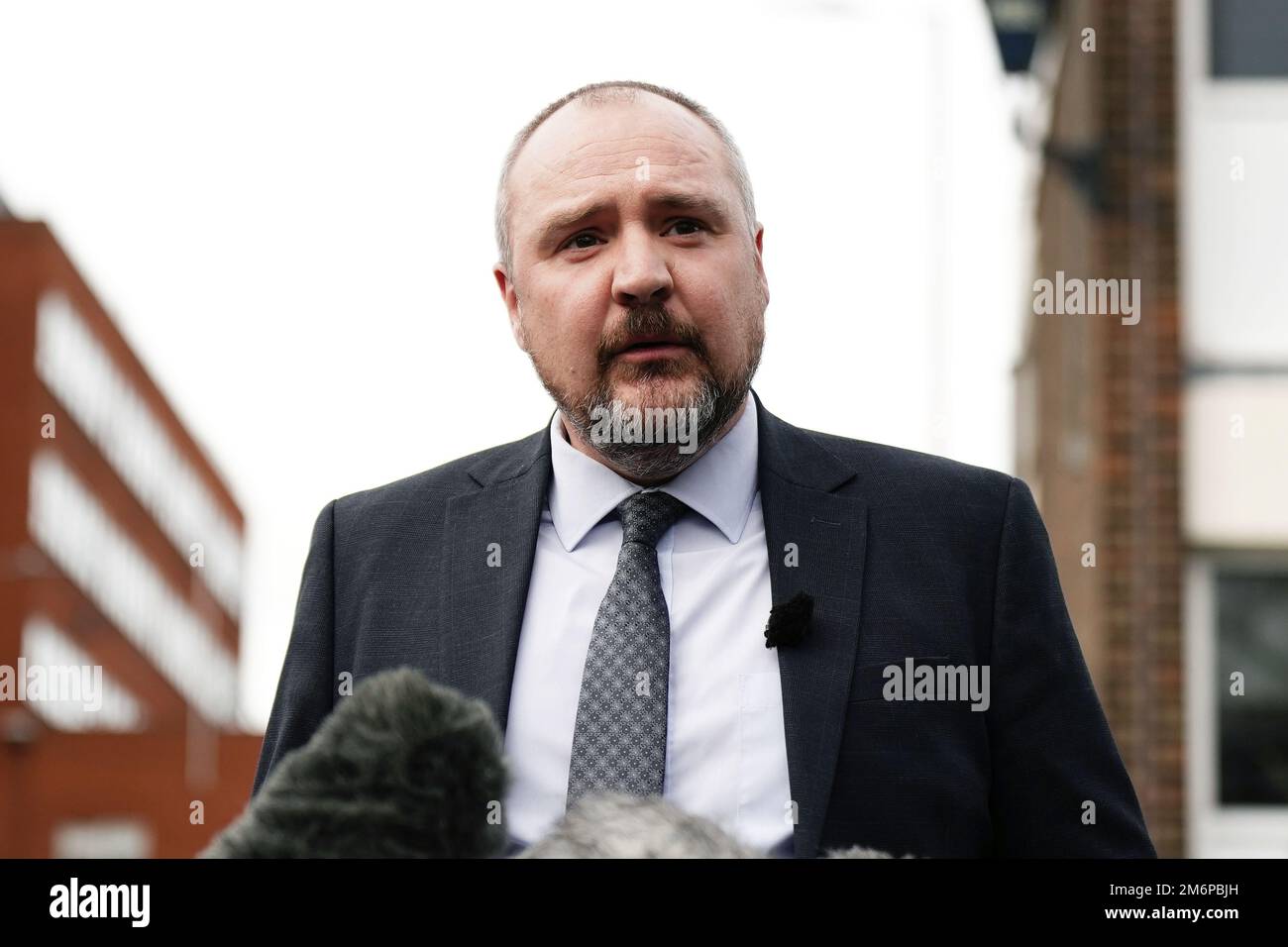 Detective Superintendent Rob Kirby updates the media gathered outside ...