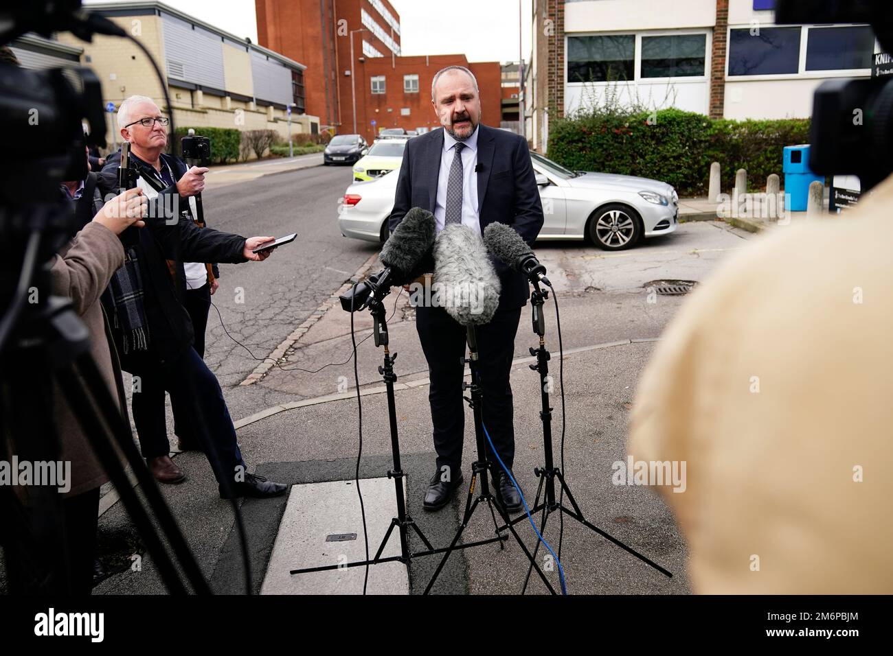 Detective Superintendent Rob Kirby updates the media gathered outside ...
