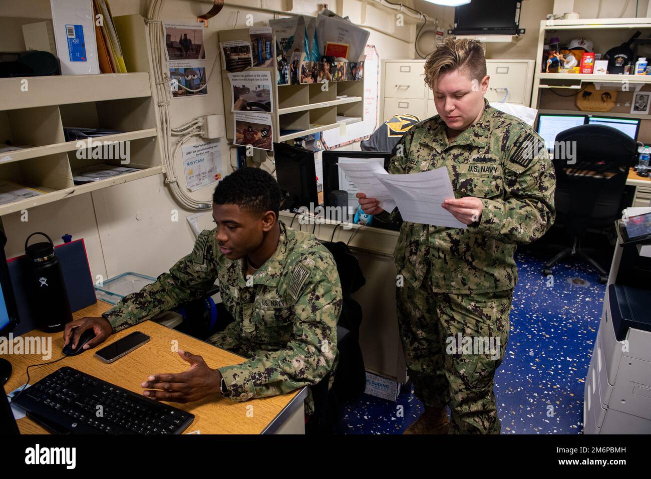 SASEBO, Japan (May 3, 2022) Yeoman Seaman Apprentice David Taylor, left ...