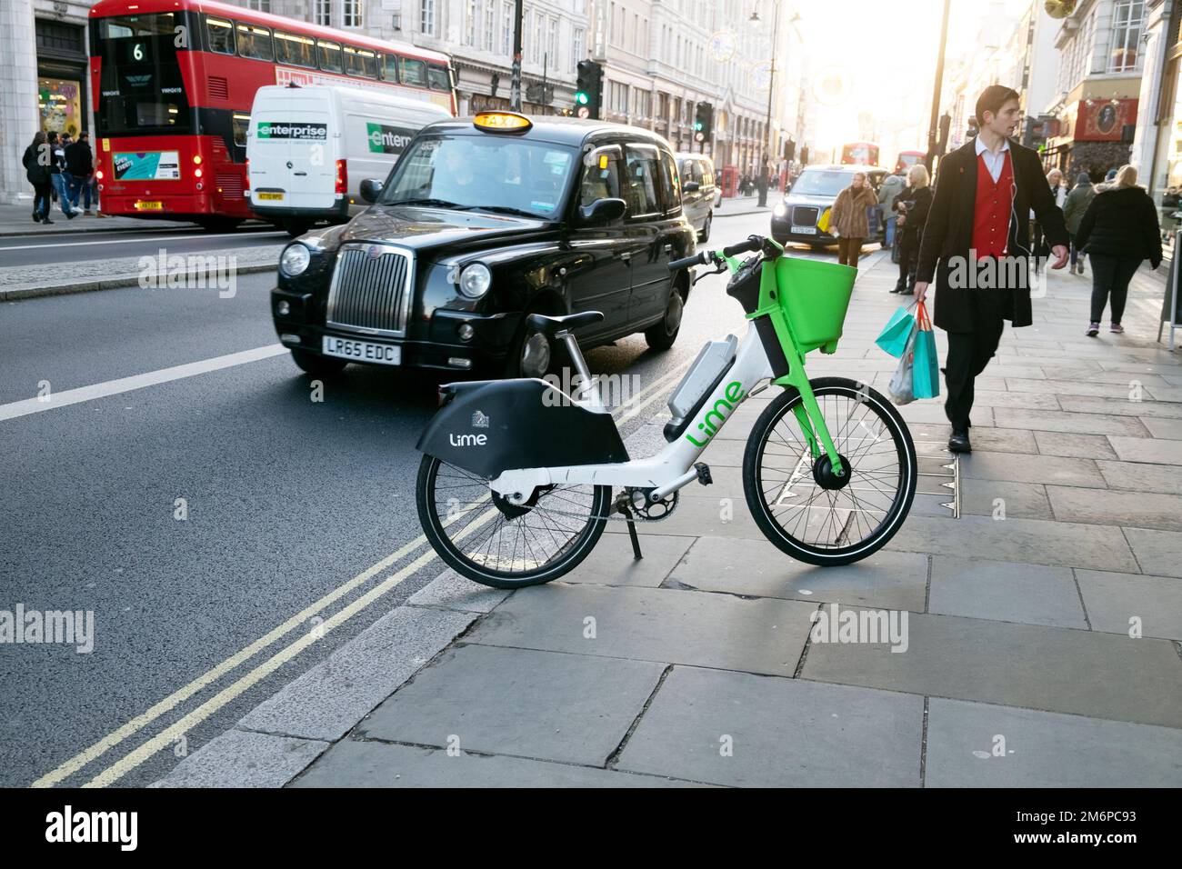 London black taxi cab double decker bus, and Lime bicycle scheme bike ...