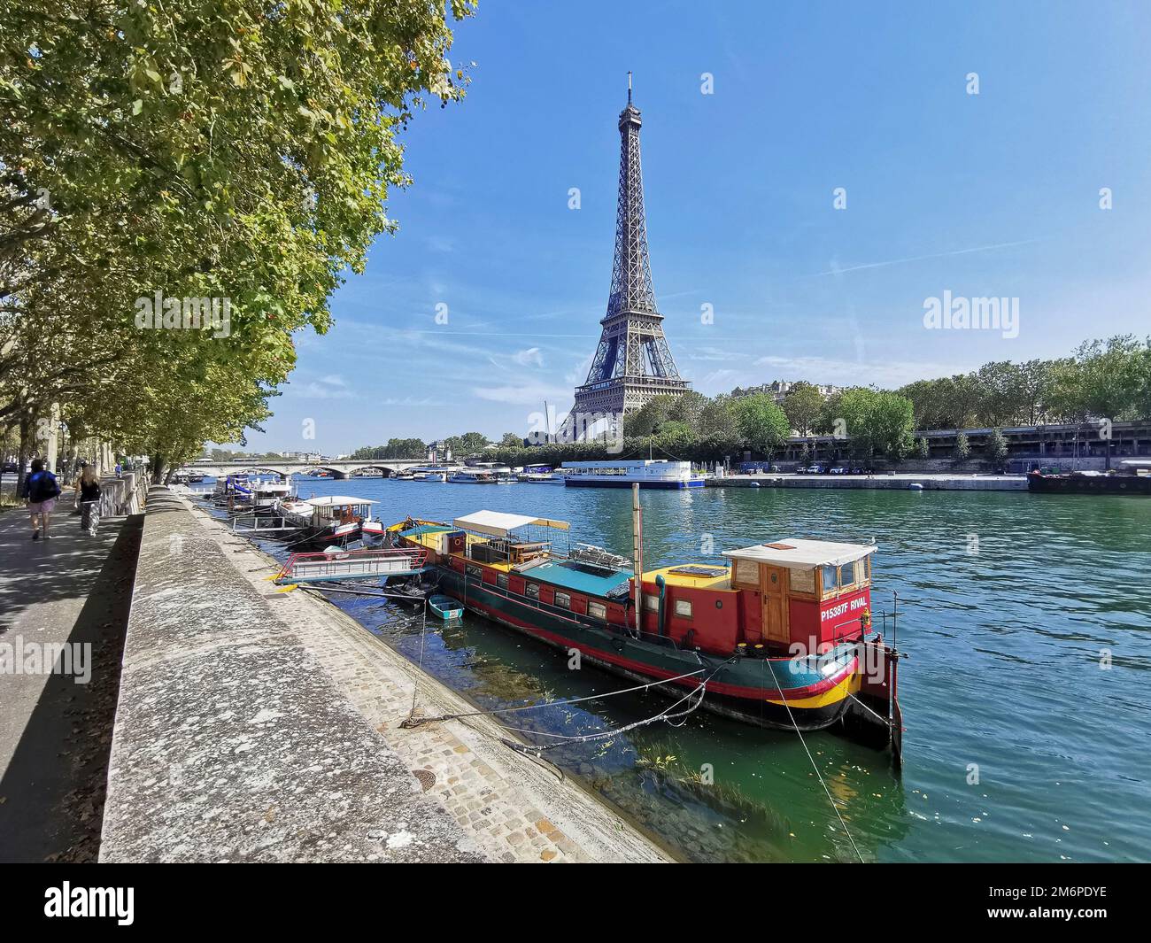 France, Paris, Boats anchored on the Seine river and view on Eiffel ...
