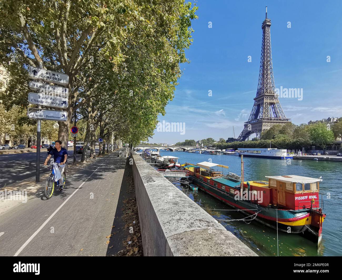 France, Paris, Boats anchored on the Seine river and view on Eiffel ...