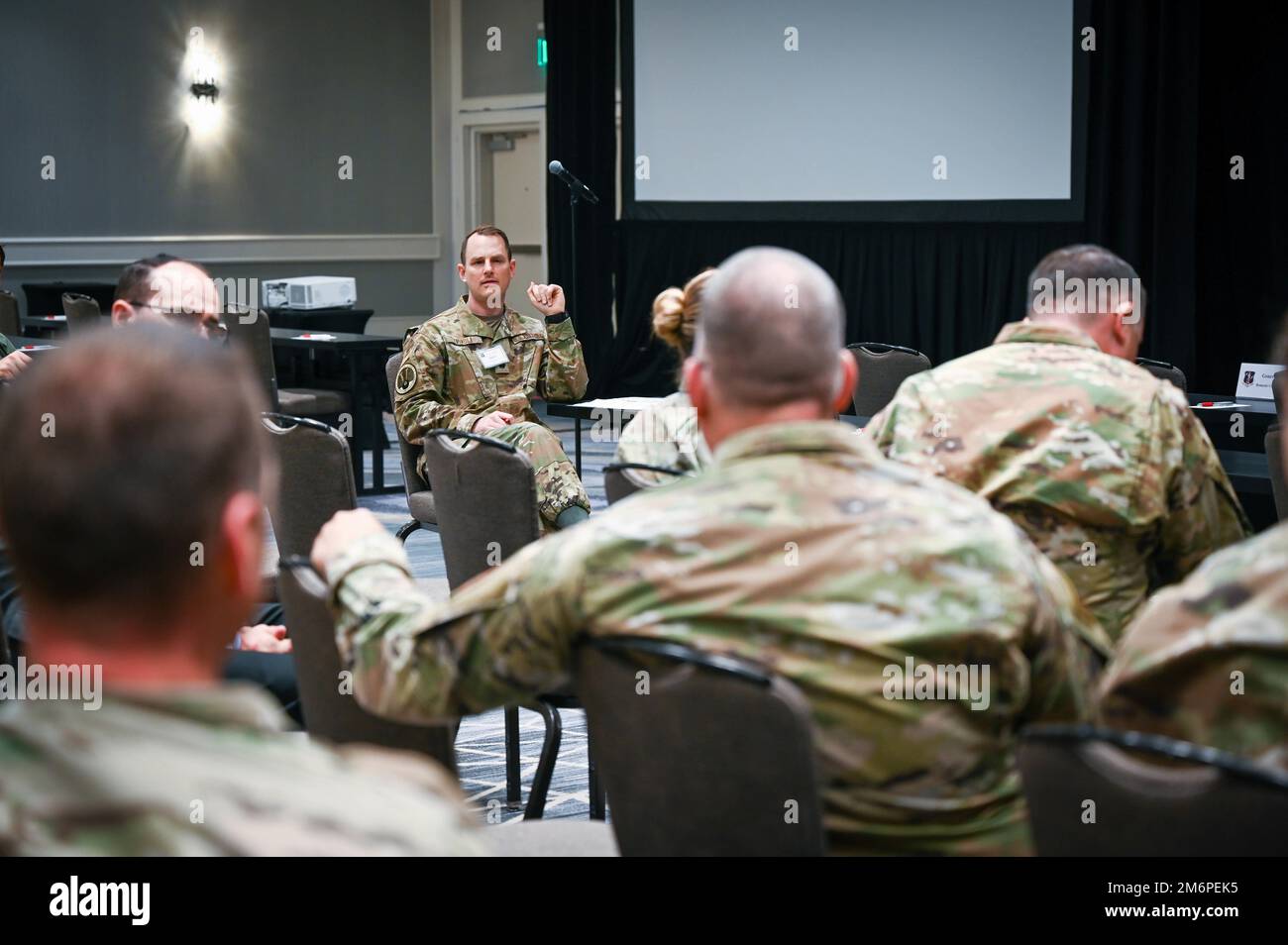 U.S. Air Force Lt. Col. Aaron Pauli, center, deputy chief, Programs and ...