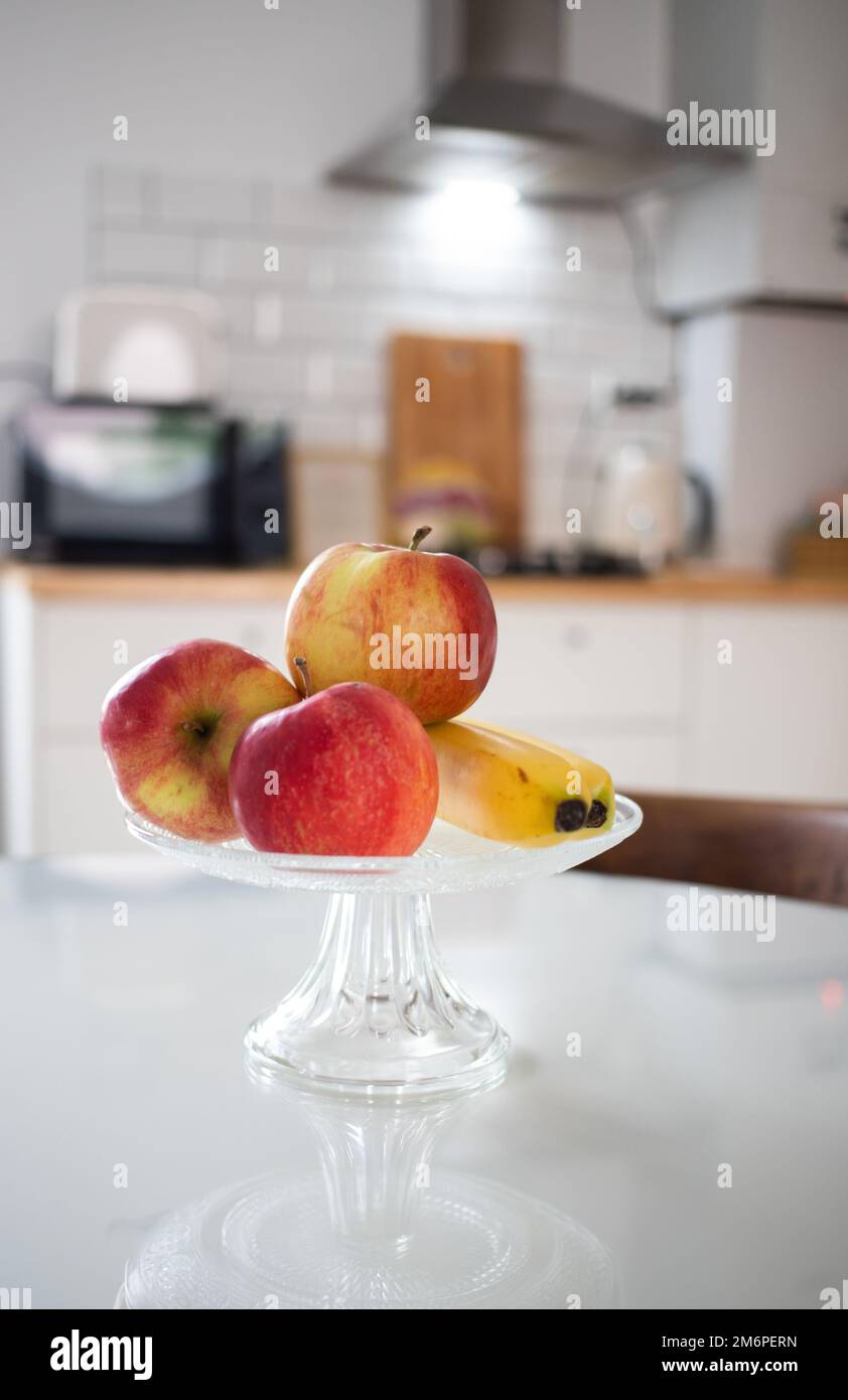 Fresh fruit apples and bananas in modern kitchen Stock Photo - Alamy