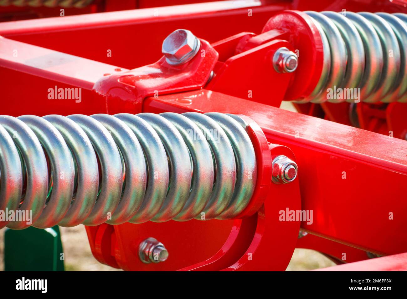 Hard silver spring made of steel. Part of big industrial or ...