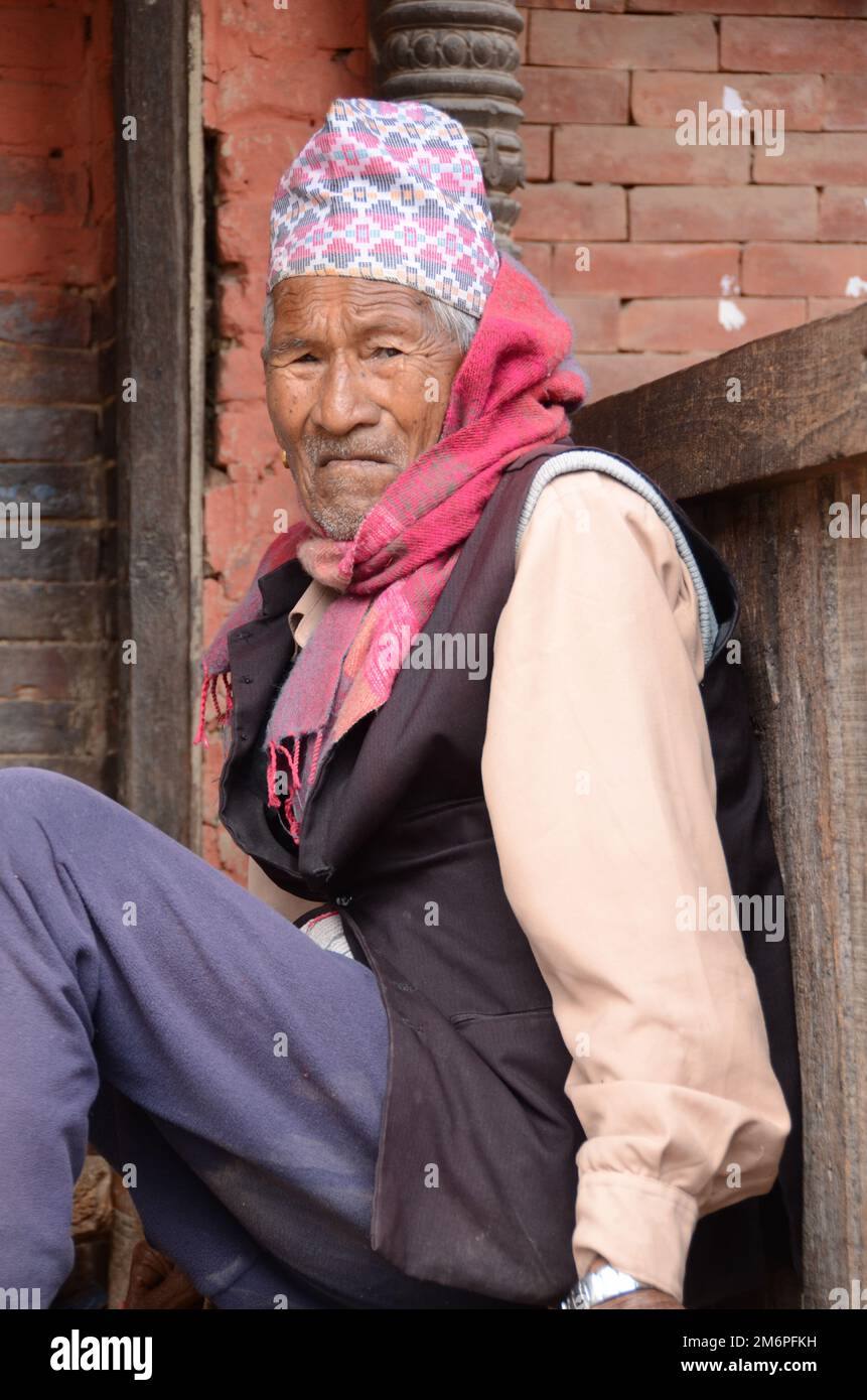 Faces of Nepal - Mature Men wearing Nepali topi Stock Photo - Alamy