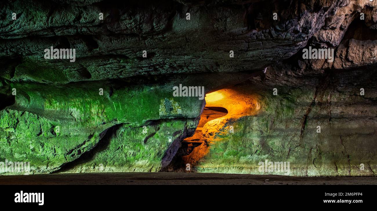 Illuminated cave in Romania pestera bolii Stock Photo - Alamy