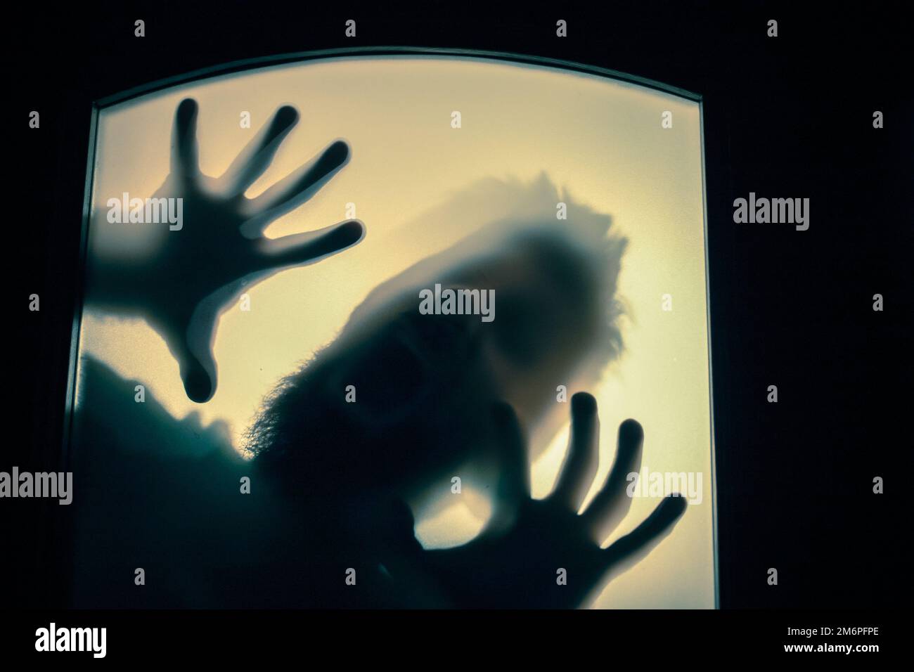 Person behind frosted glass hi-res stock photography and images - Alamy