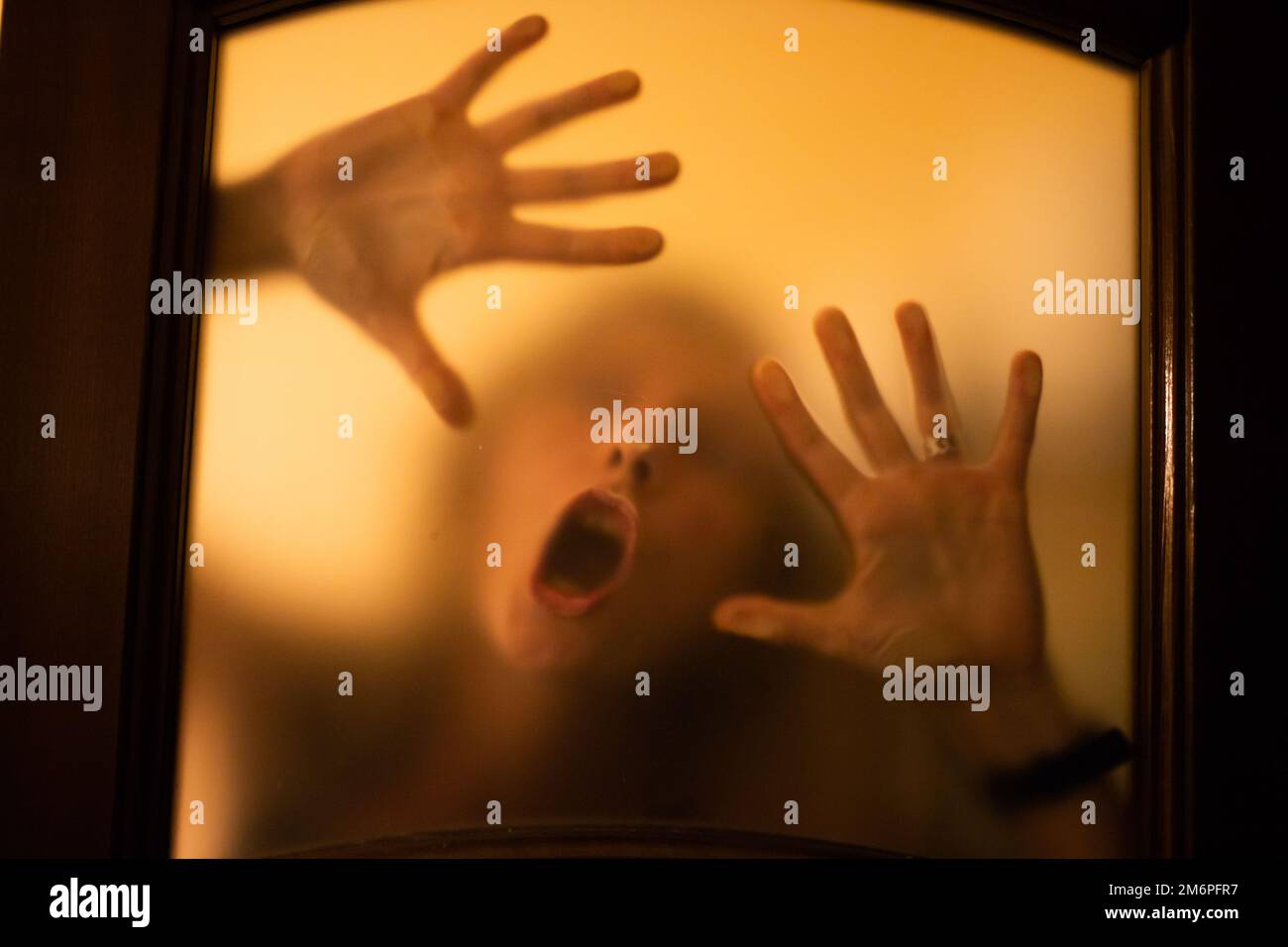 Scary picture of hands behind glass, horror ghost woman behind door ...