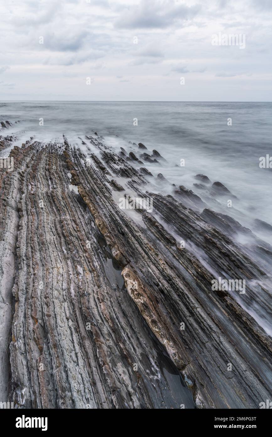 Sunset at the Flysch geological coastline, with Flysch formations in ...